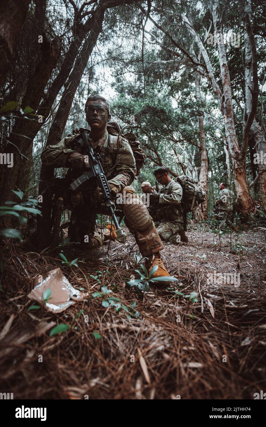 U.S. Soldier attending the Small Unit Ranger Tactics course pulls ...
