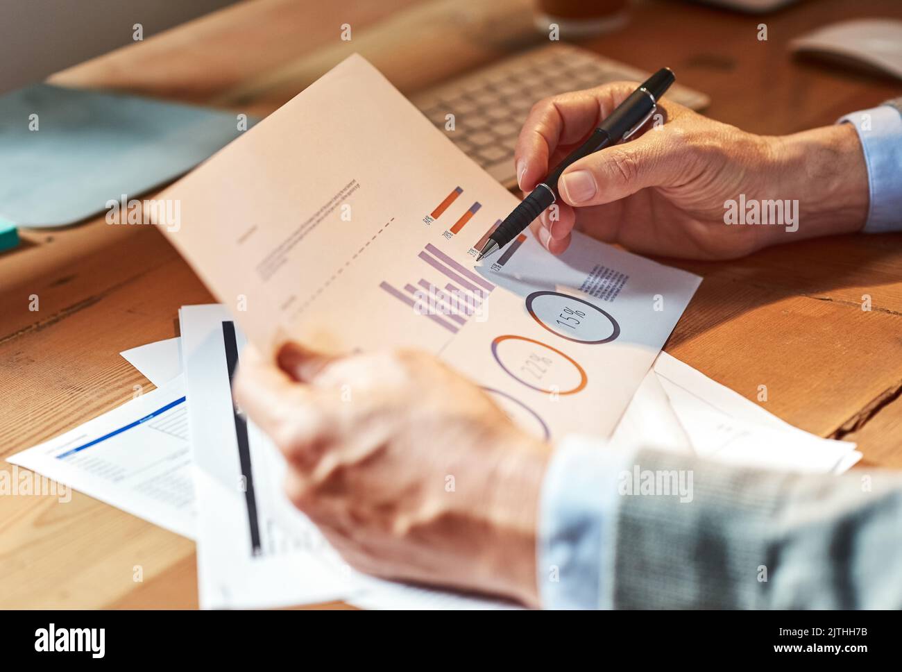 Businessman going over report hi-res stock photography and images - Alamy