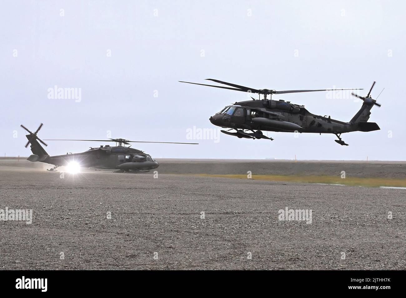 A pair of UH-60 Black Hawk helicopters take off from the Deadhorse ...