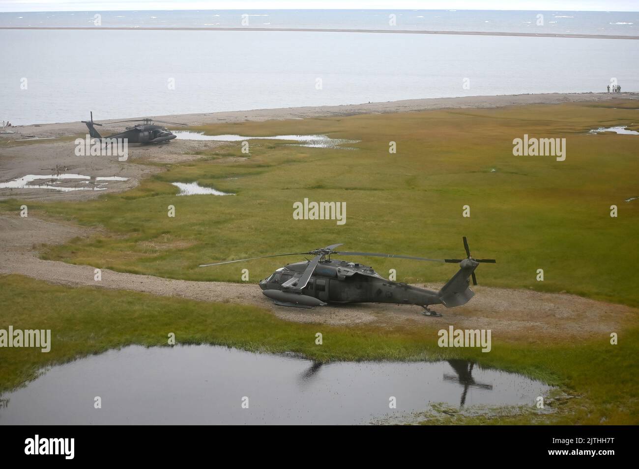 Air crews from two UH-60 Black Hawk helicopters take in the view of the ...