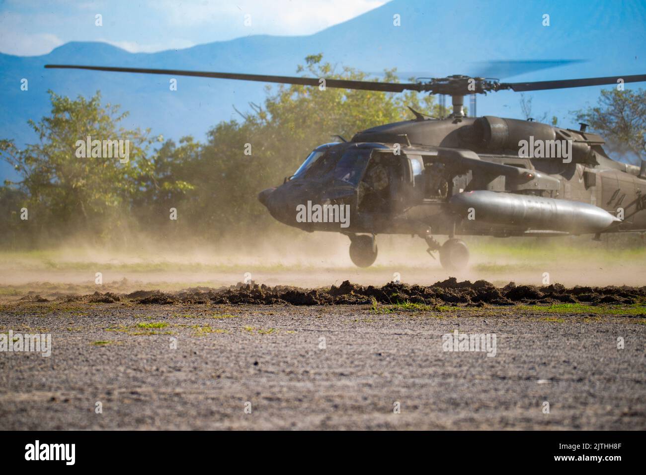 A U.S. Army UH-60 Black Hawk helicopter lands for cold refueling in ...