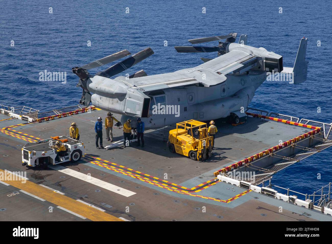 220830-N-VJ326-2030 SOUTH CHINA SEA (Aug. 30, 2022) – Sailors attach an ...