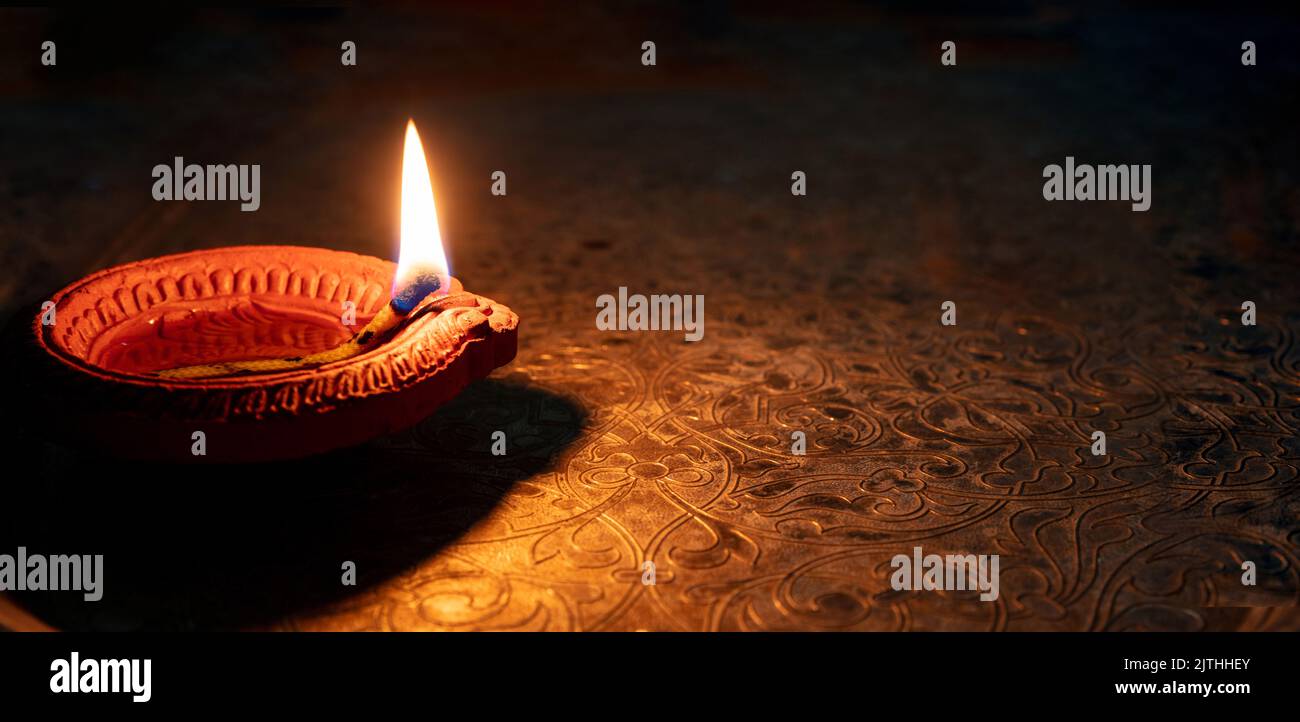 Diwali, Hindu festival of lights. Clay diya candle in Deepavali. Oil ...