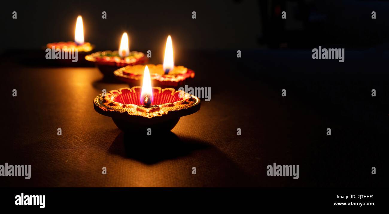 Diwali celebration. Deepavali Hindu festival of lights. Clay diya ...