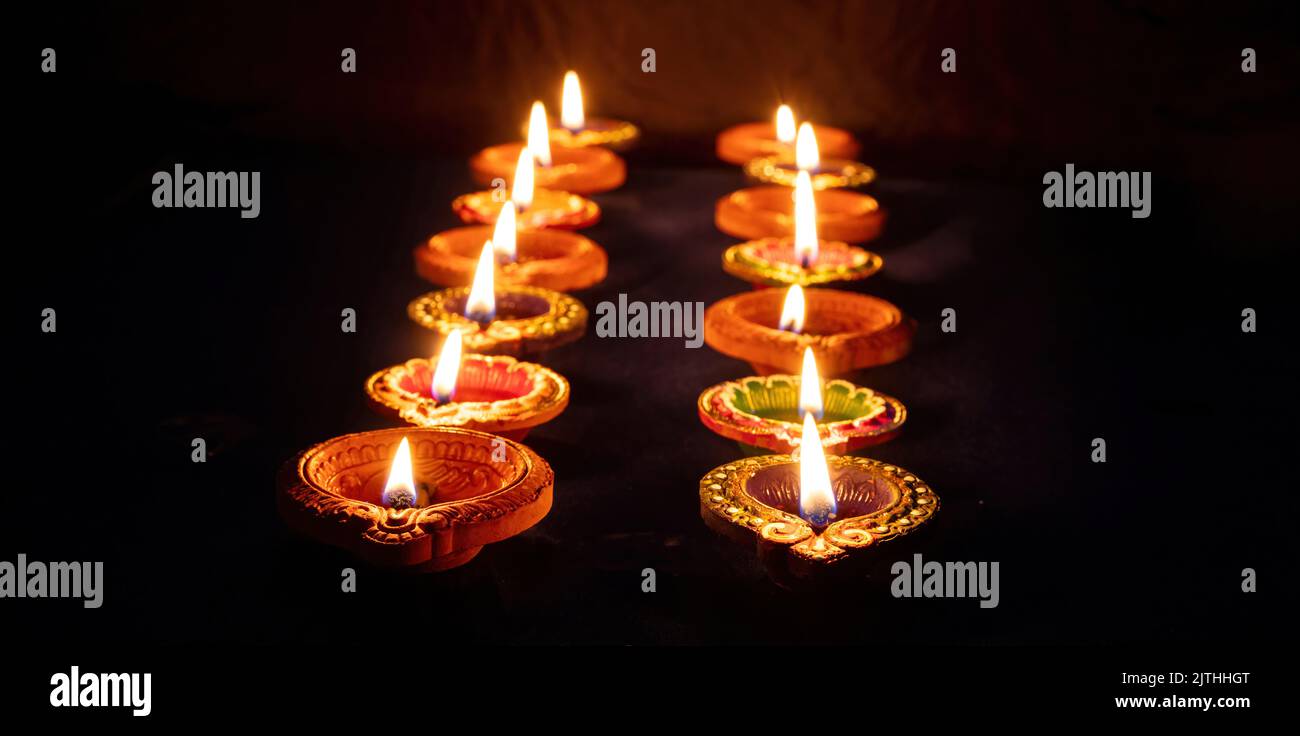 Diwali. Deepavali Hindu festival of lights. Clay diya candles in rows ...