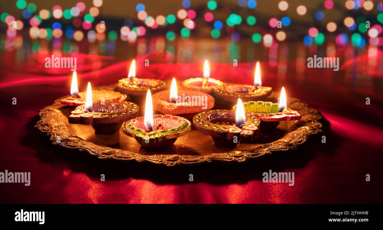 Happy Diwali. Diya oil lamps lit at Deepavali celebration. Hindu ...