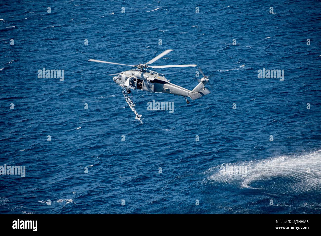 An MH-60S Sea Hawk attached to Helicopter Sea Combat Squadron (HSC) 21 ...