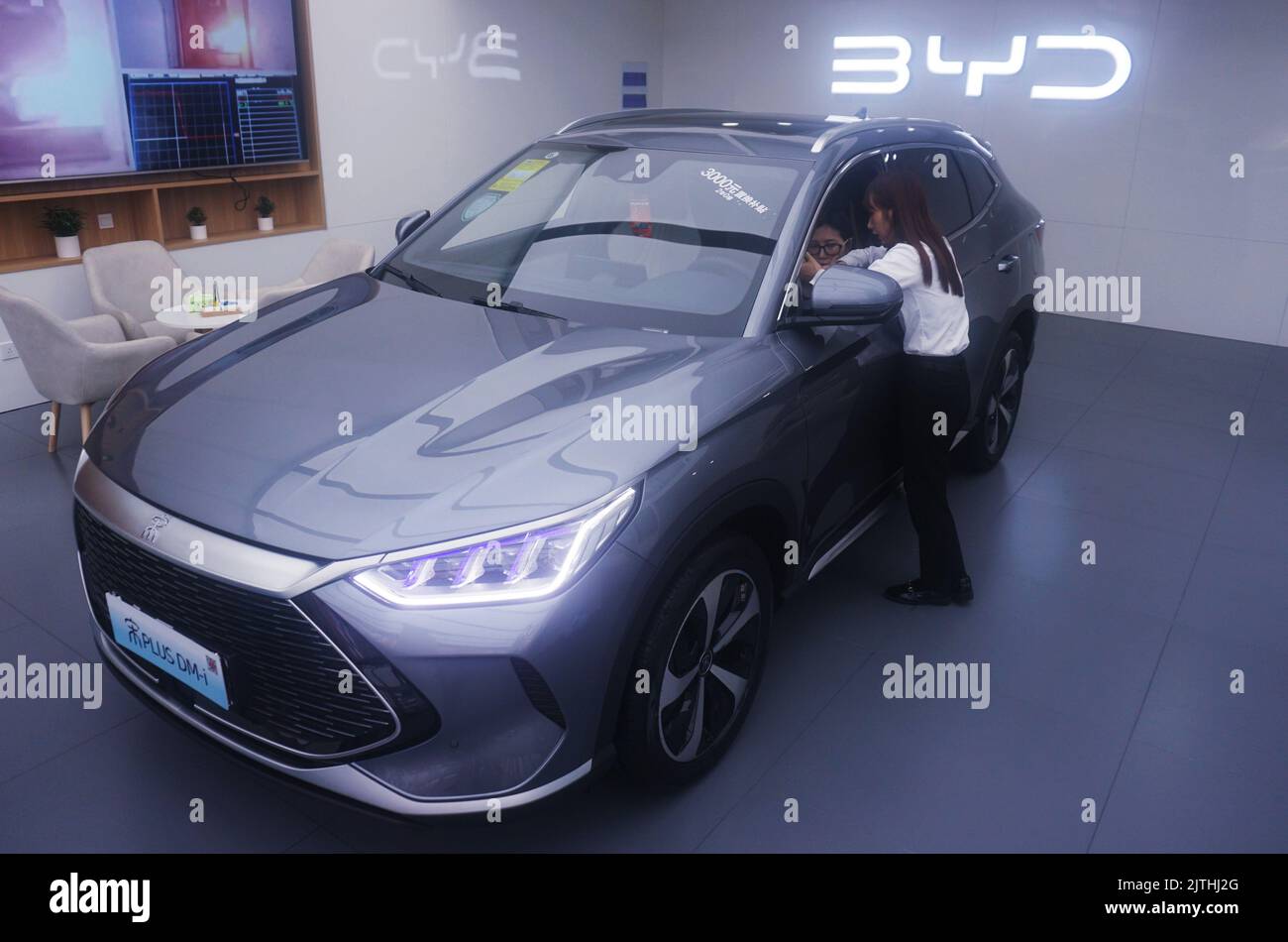 HANGZHOU, CHINA - AUGUST 31, 2022 - Customers choose new energy vehicles at a BYD store in ...