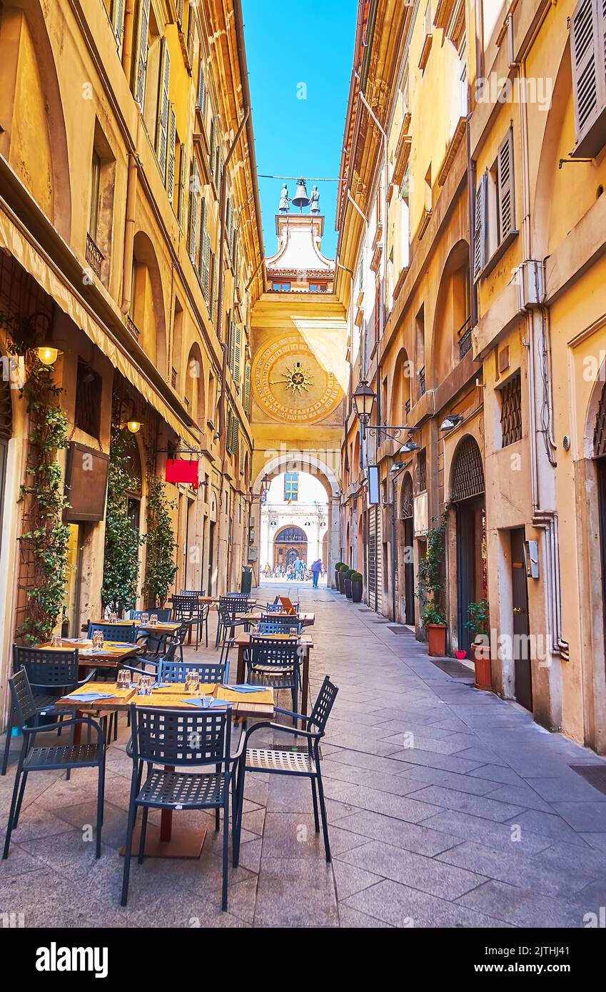 The narrow alley of Via Cesare Beccaria, lined with historic buildings ...