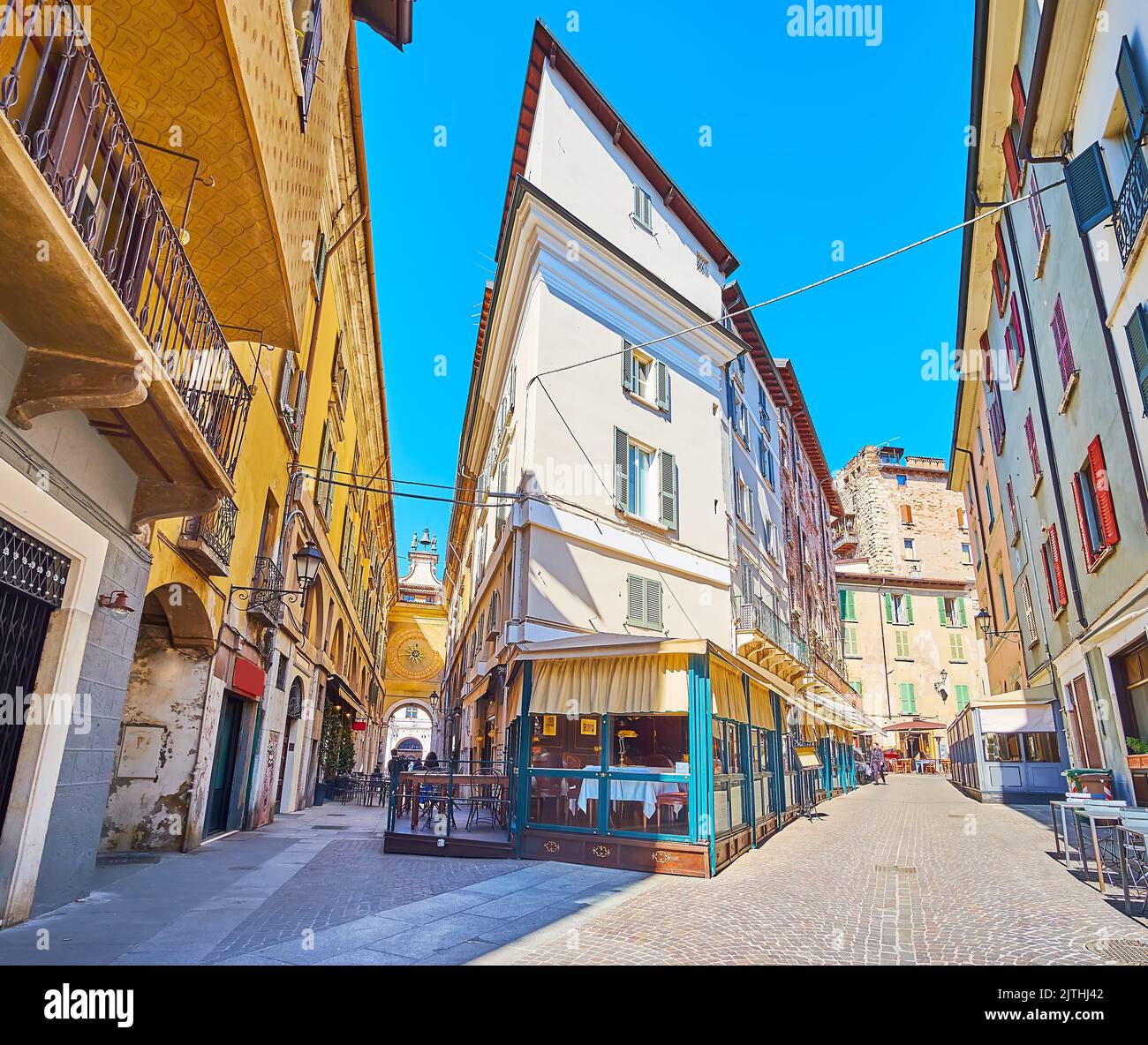 The medieval architecture on Via Cesare Beccaria with restored corner ...