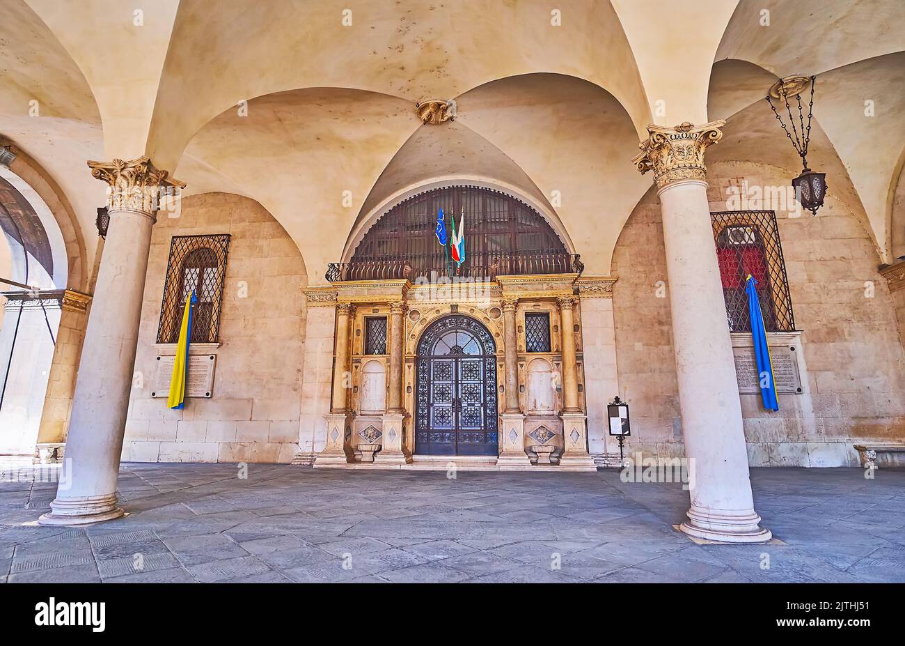 Historic portico of Renaissance Palazzo della Loggia with rich carved ...