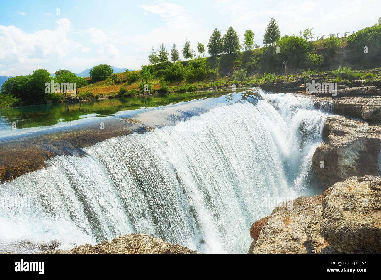 Spring Niagara waterfall in Montenegro with fast water stream and green ...