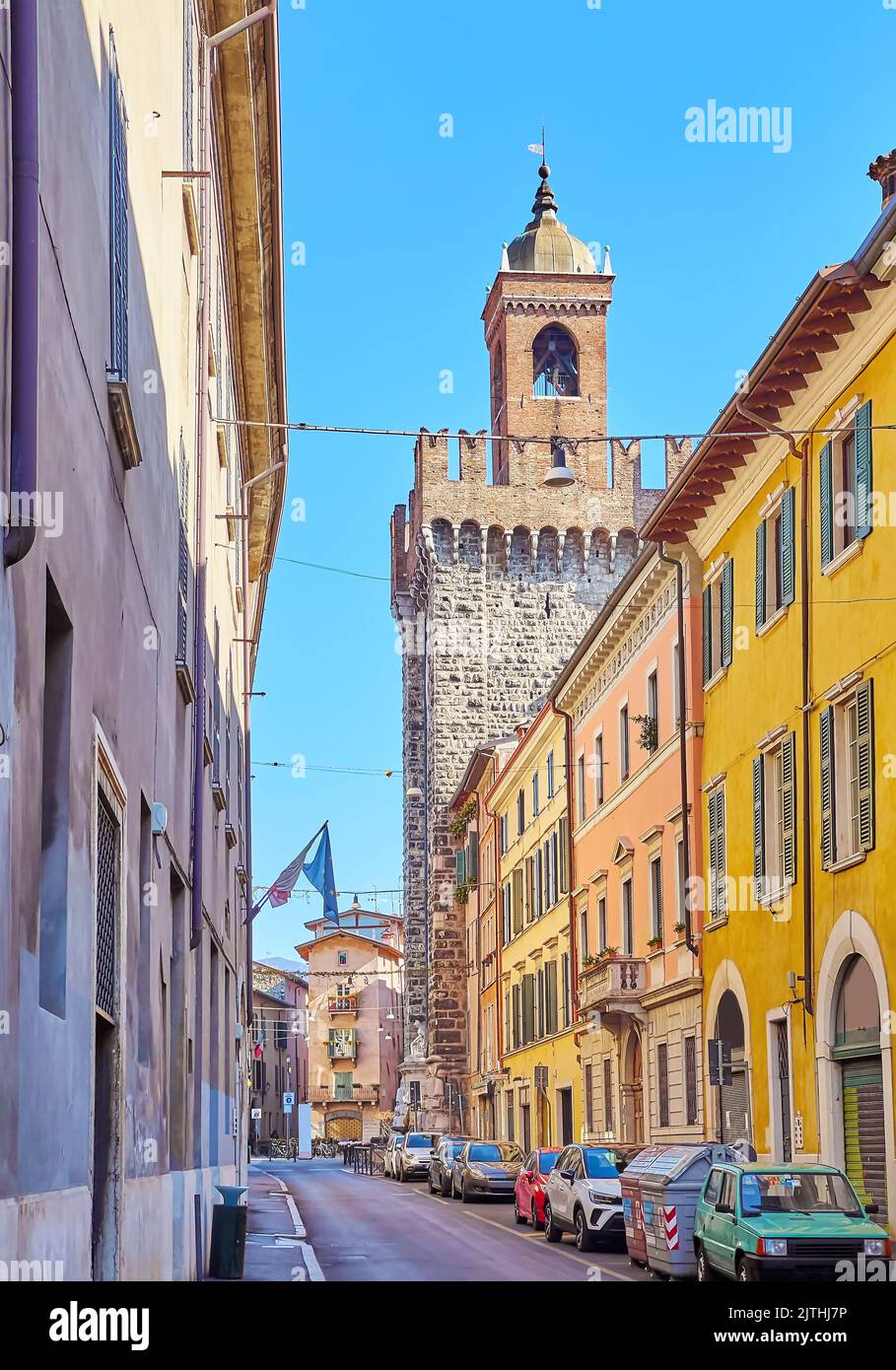 The narrow Via della Pace Street with line of historic houses and ...