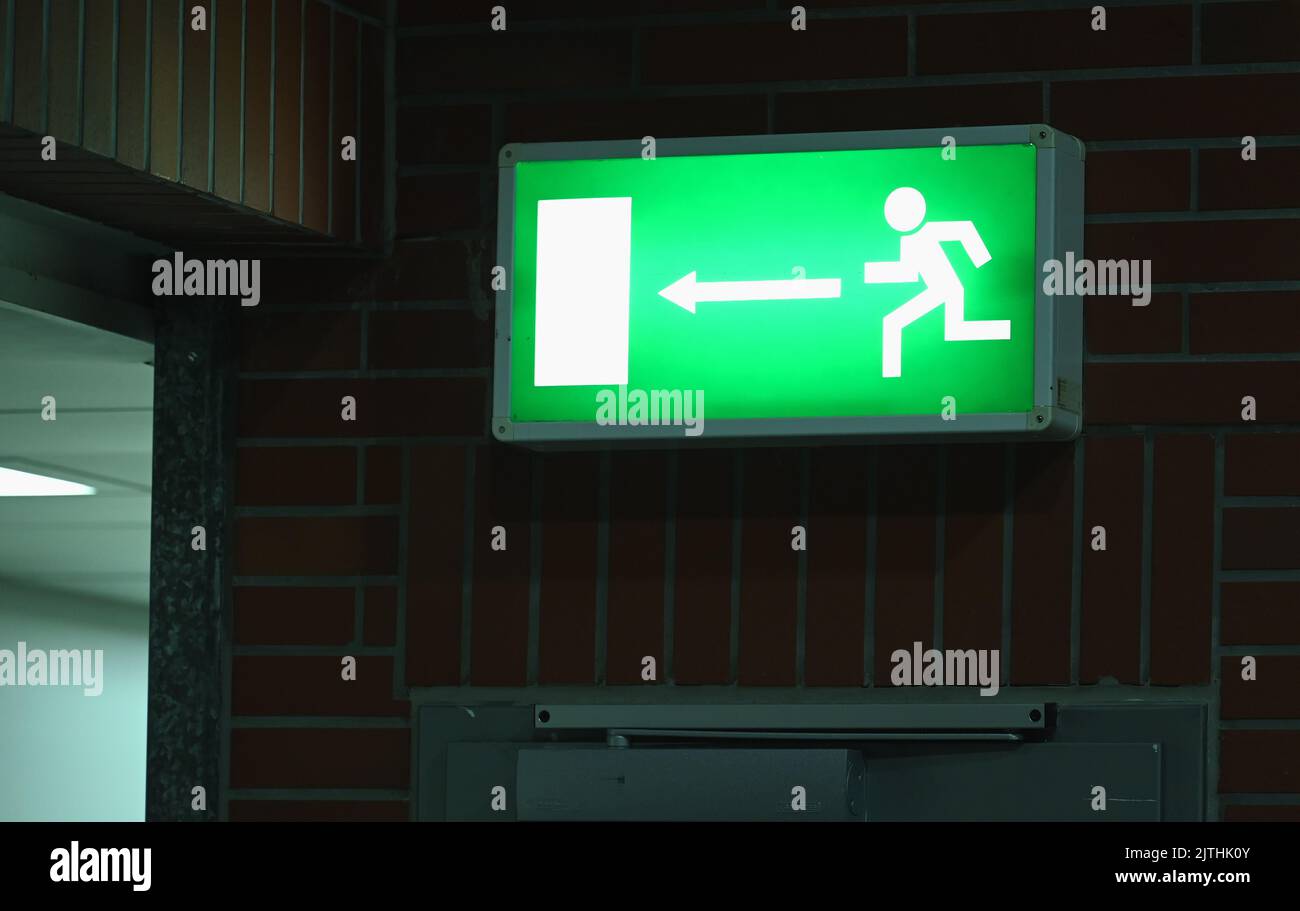 Cologne, Germany. 29th Aug, 2022. green sign escape route, emergency ...