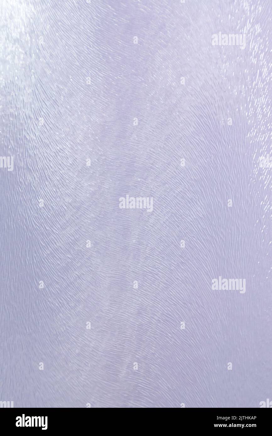 Close-up of uneven backlit glass surface with abstract lines & patterns ...