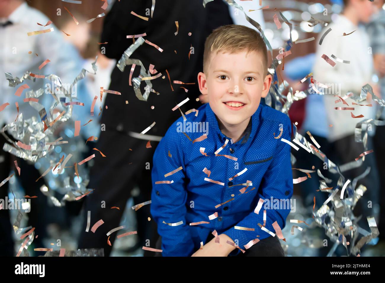 Happy little boy in confetti.Magic time - Portrait of a very happy ...