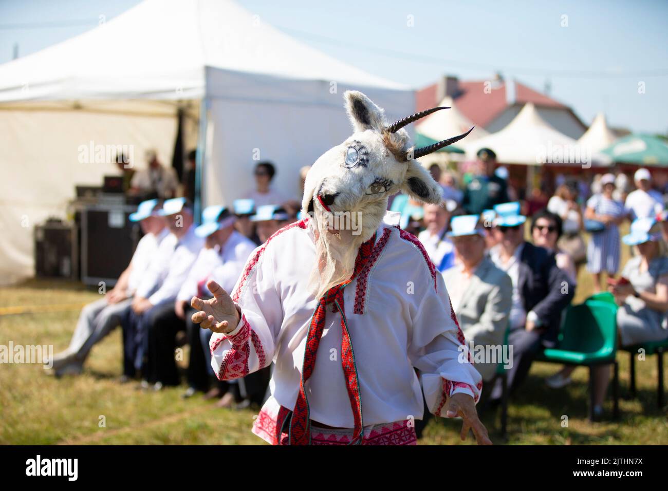 Festival of ethnic cultures. A man in a Slavic ethnic ritual costume of ...