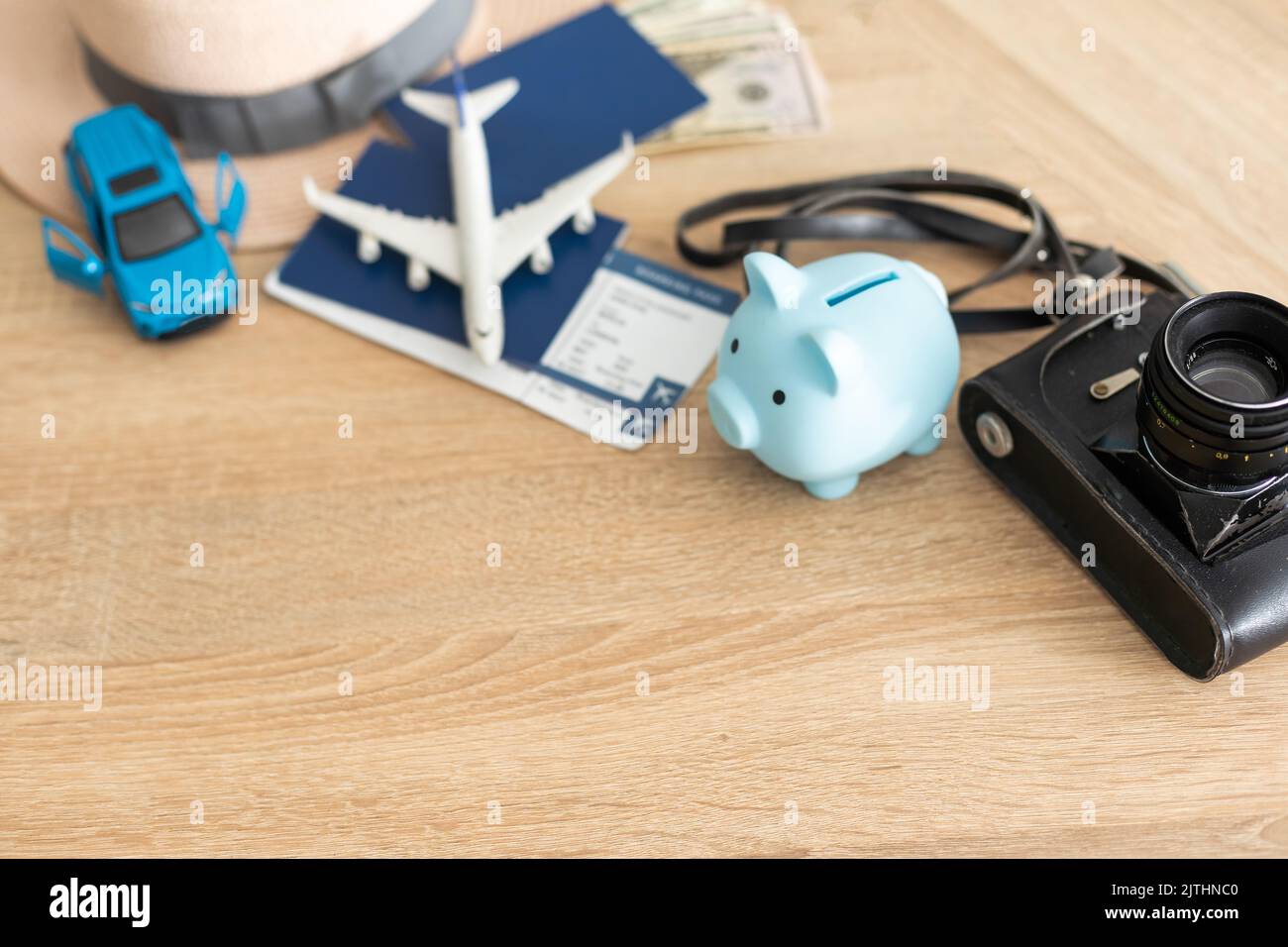 Travel concept. Airplane model, camera and passport on the table Stock ...