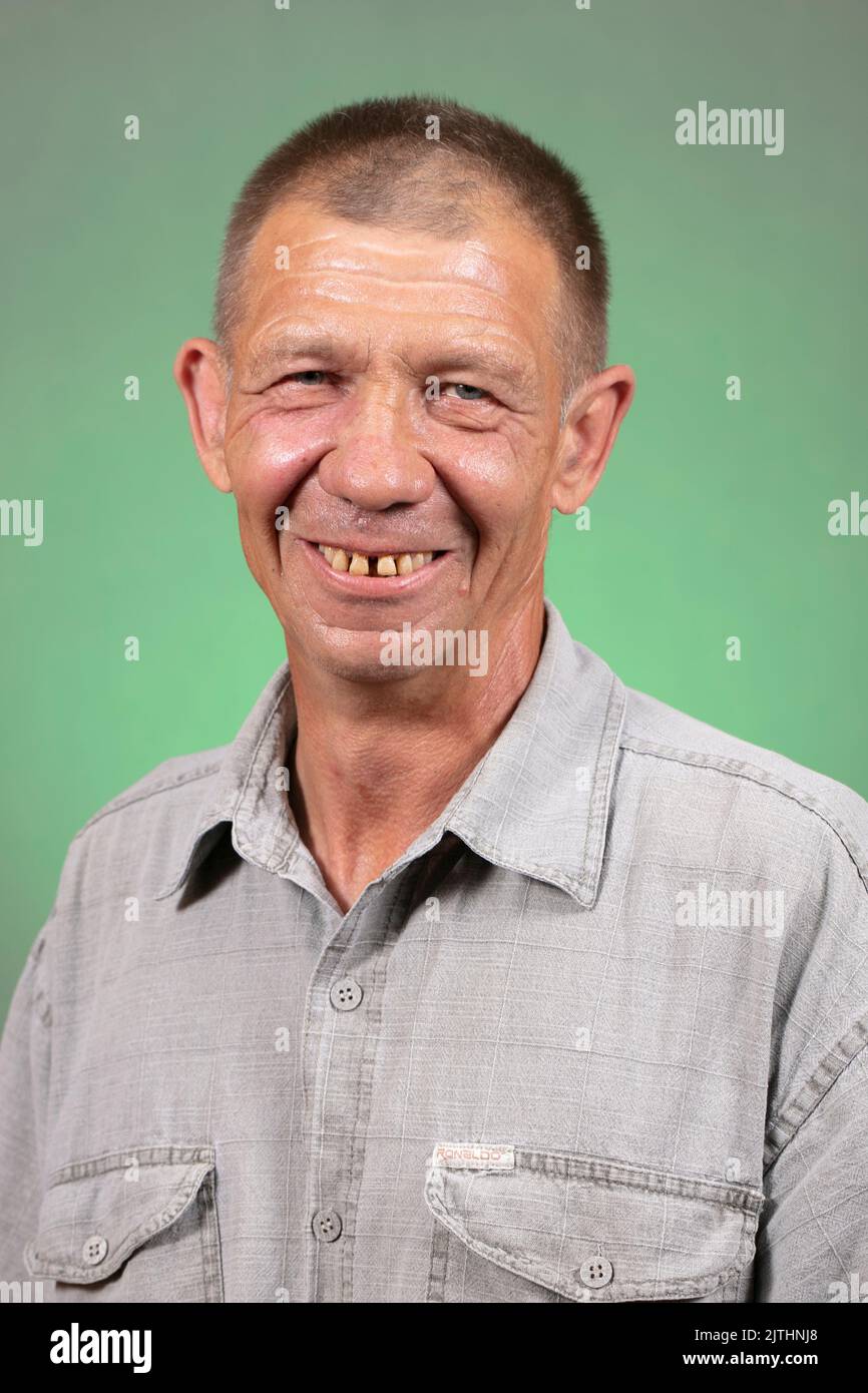 Portrait of an elderly funny man with a cute smile Stock Photo - Alamy
