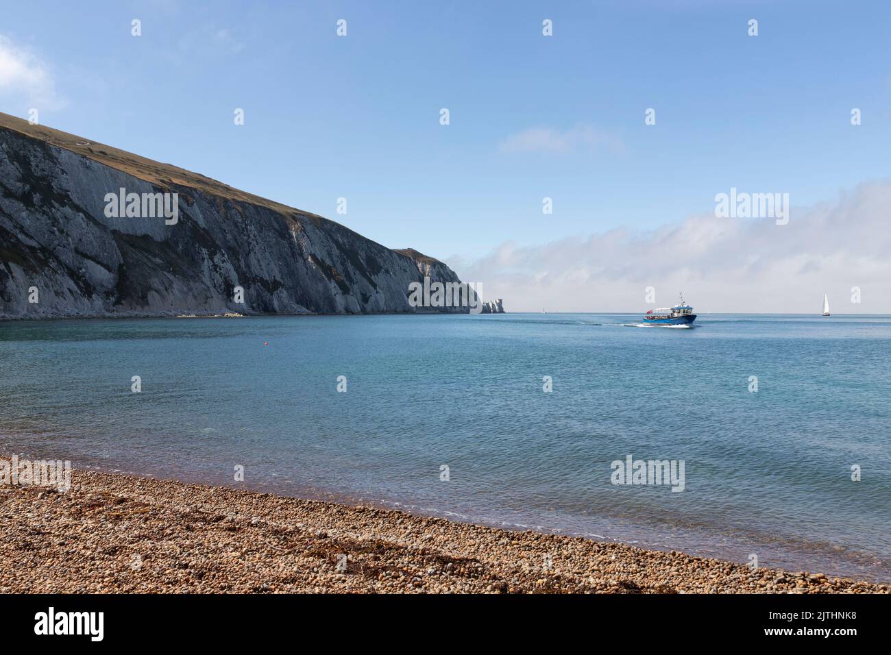 Landscape / seascape view of the Needles and a boat in the distance ...