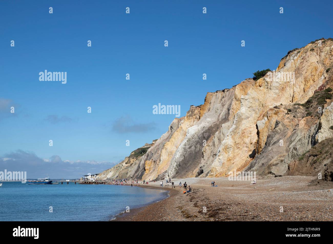 The beach, sea, and multi-coloured sand cliffs of Alum Bay, on the Isle ...
