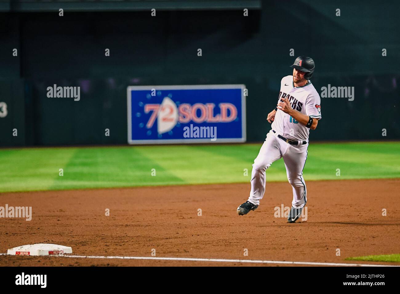 Arizona Diamondbacks catcher Carson Kelly (18) rounds third base in the ...