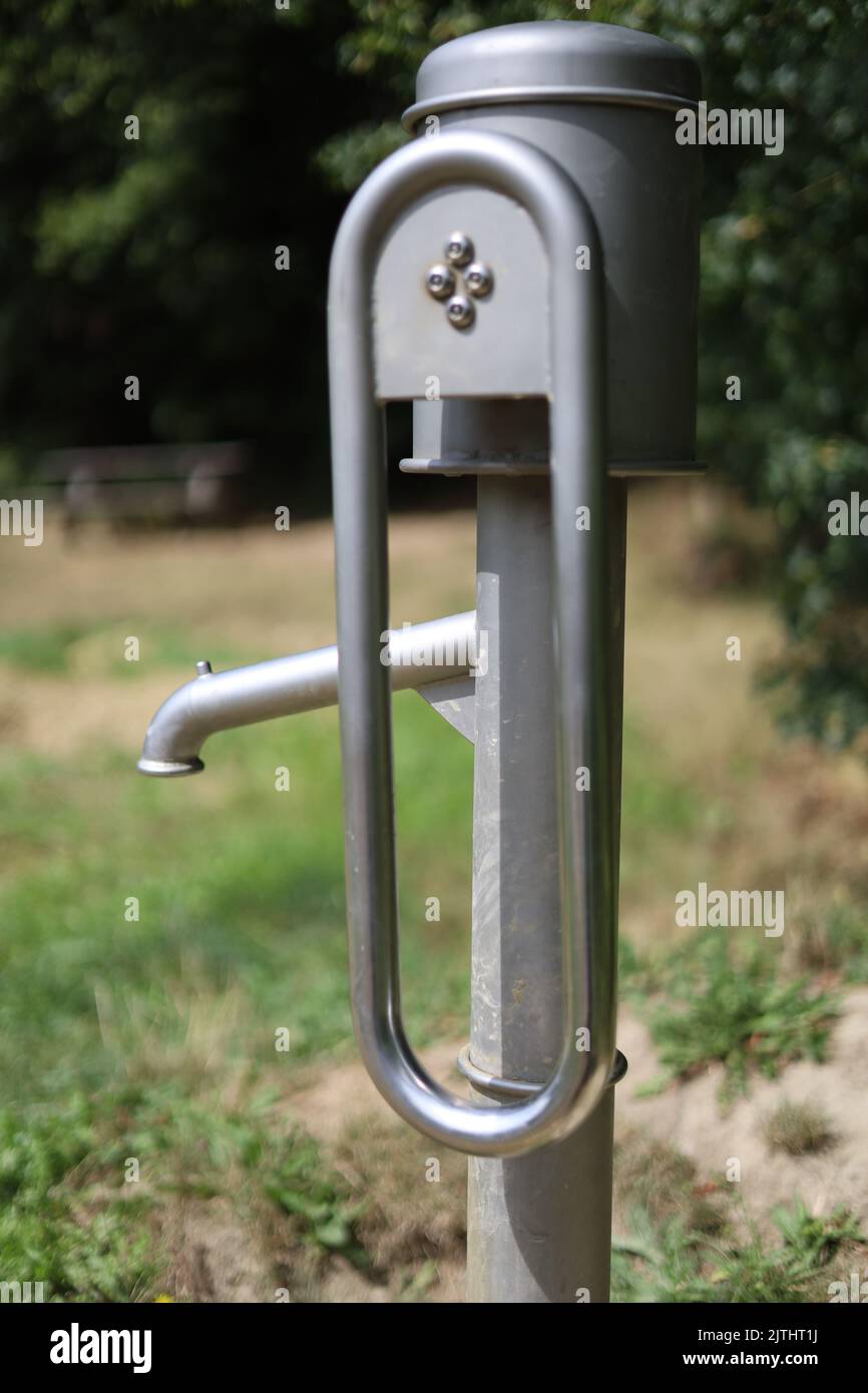 A water pump on a playground in Austria for water supply Stock Photo ...