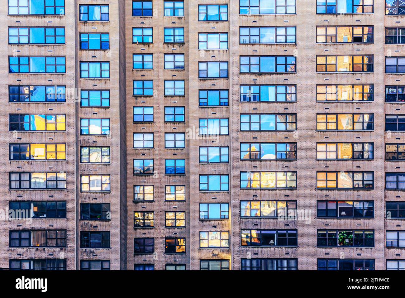 A modern building with reflections on the glassy windows Stock Photo ...