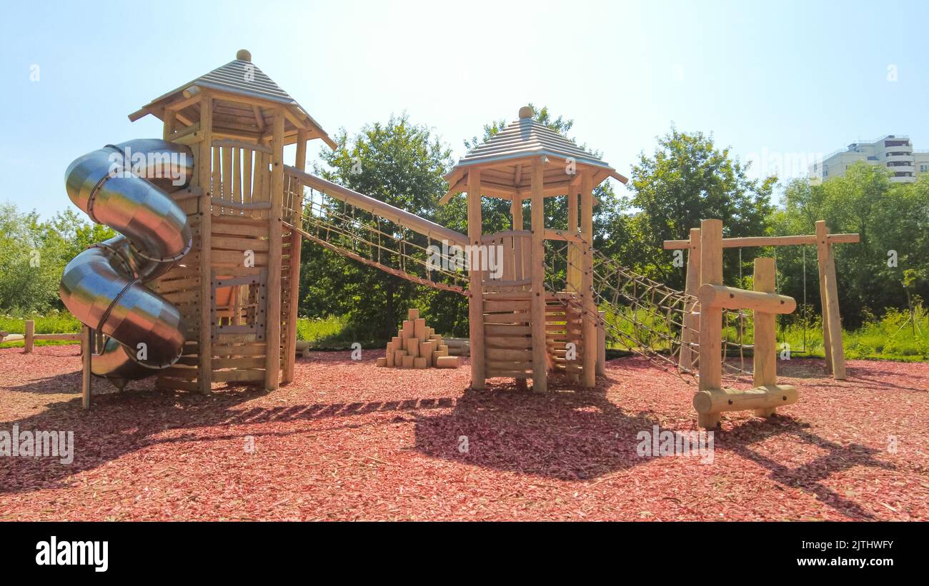 Modern children's playground for outdoor games, a slide pipe made of ...