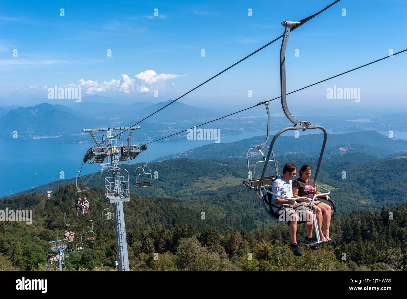Chairlift to the top of Monte Mottarone with Lake Maggiore in the ...