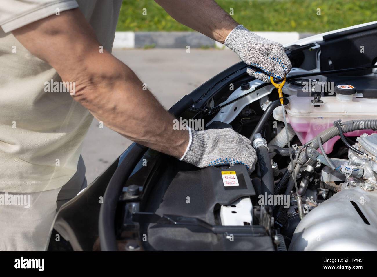 Man checks oil level hi-res stock photography and images - Alamy