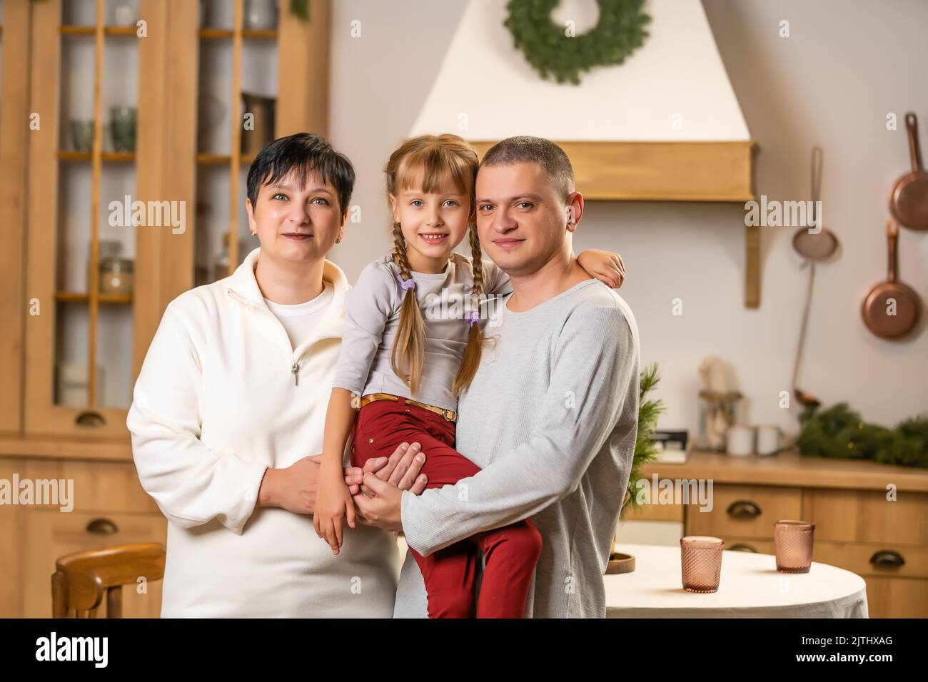 The young happy family is getting ready for the Christmas and Advent ...