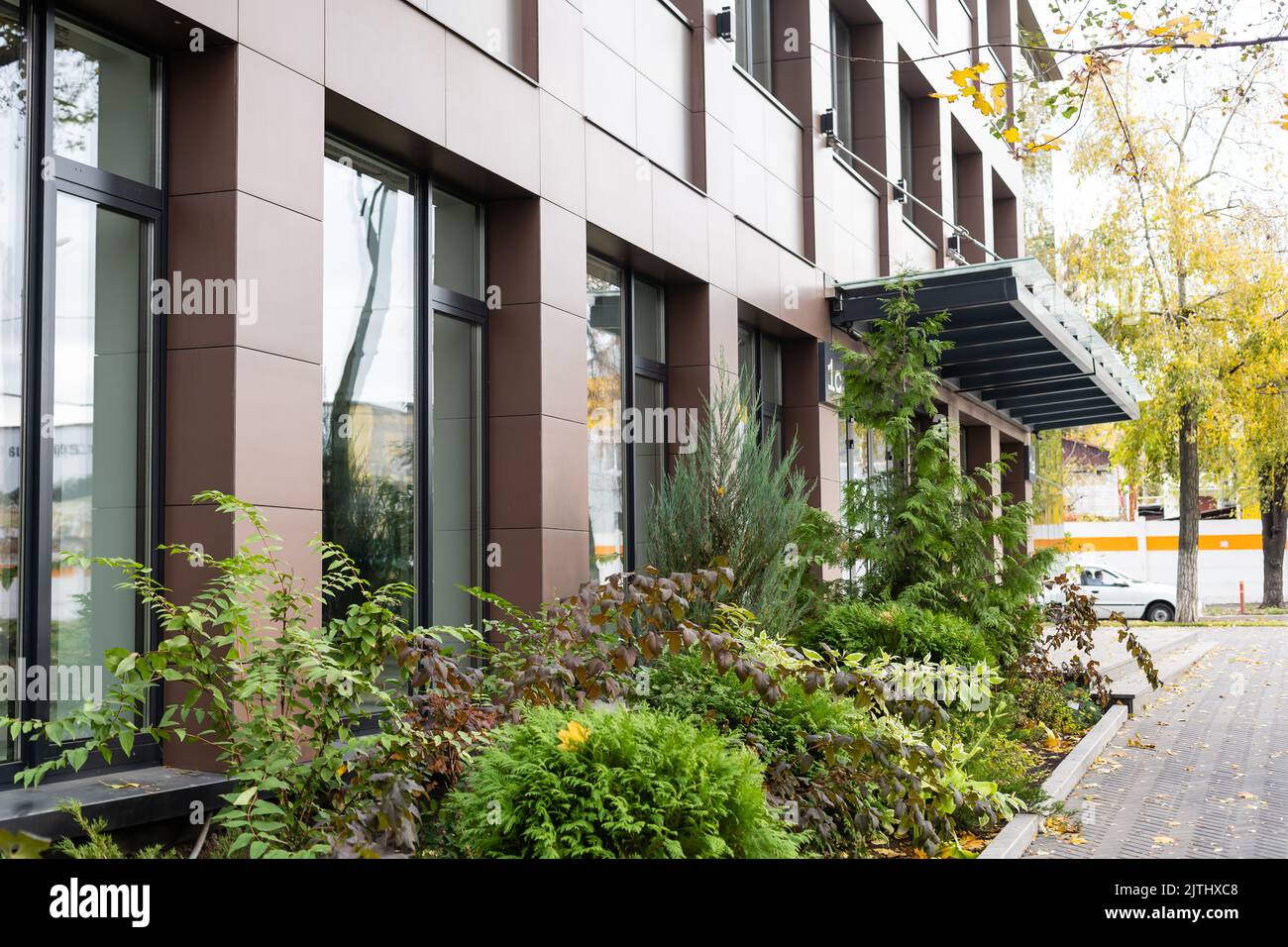 green landscaping near the facade of a business building Stock Photo ...