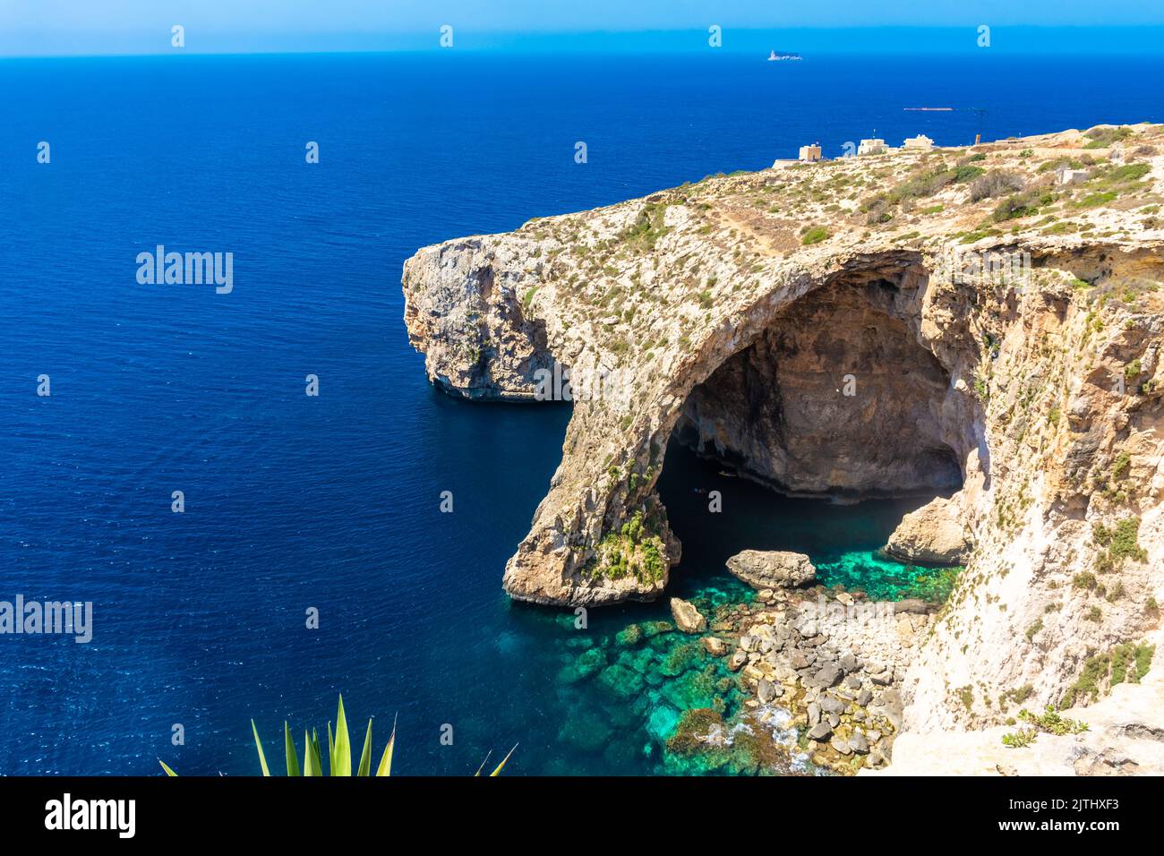 The Blue Grotto of Malta, rock formation on the sea with crystal clear ...