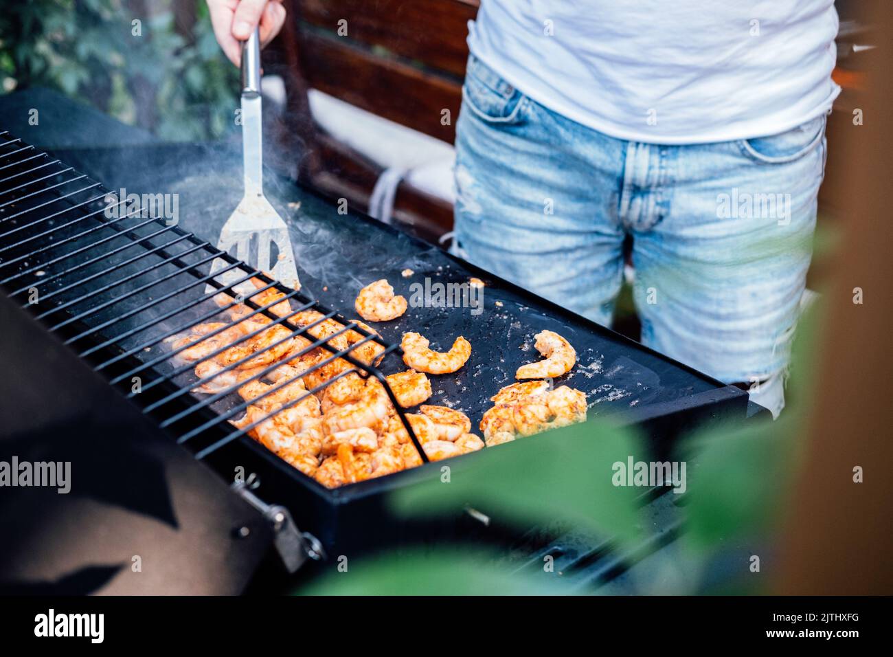 Grilling shrimp on skewer on outdoor grill. Grilled shrimps on the ...