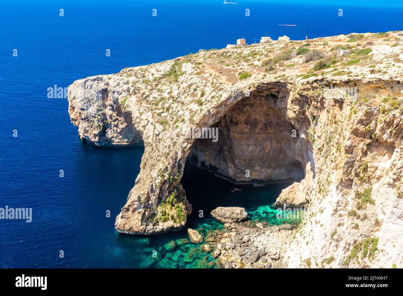 The Blue Grotto of Malta, rock formation on the sea with crystal clear ...