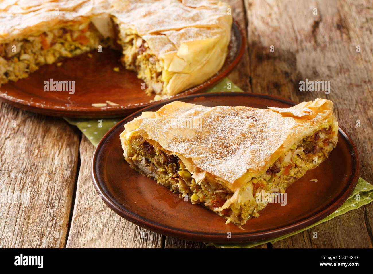 Piece Chicken Bastilla pastilla Moroccan pie closeup in the plate on ...