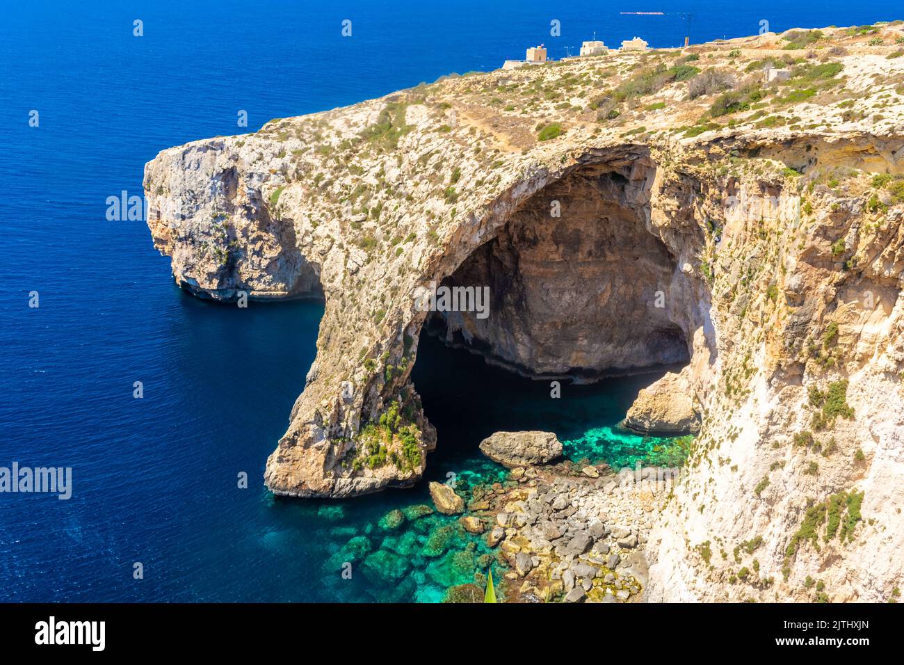 The Blue Grotto of Malta, rock formation on the sea with crystal clear ...