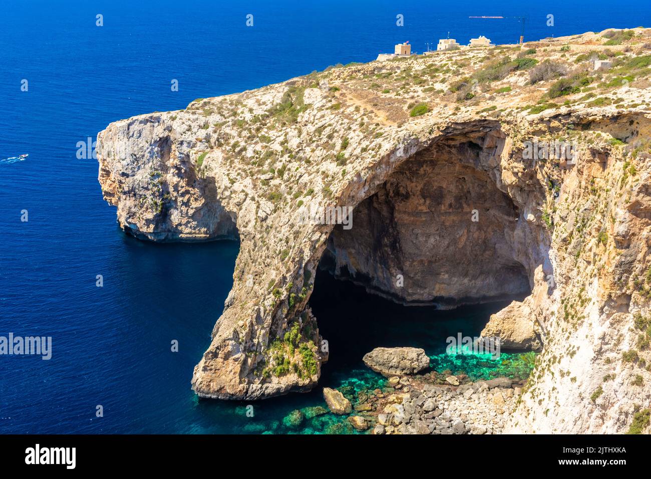 The Blue Grotto of Malta, rock formation on the sea with crystal clear ...
