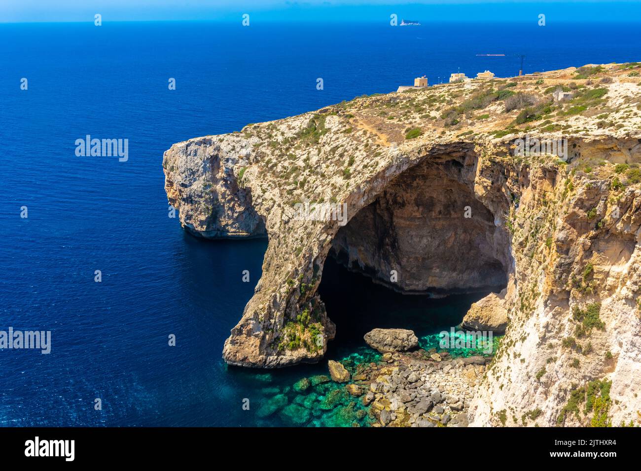 The Blue Grotto of Malta, rock formation on the sea with crystal clear ...