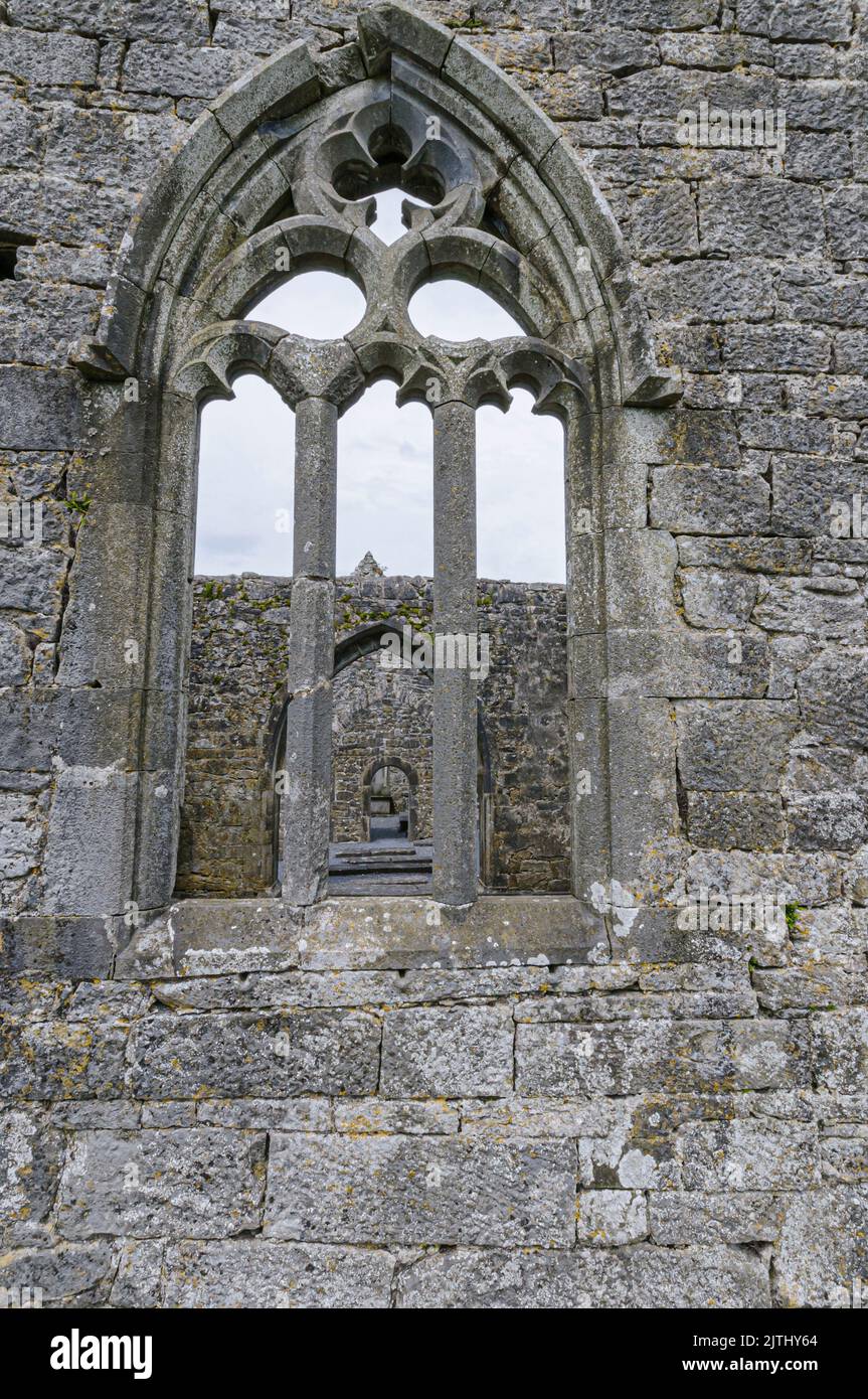 Stone carved window at the ruins of Kilmadough Irish church, Ireland ...