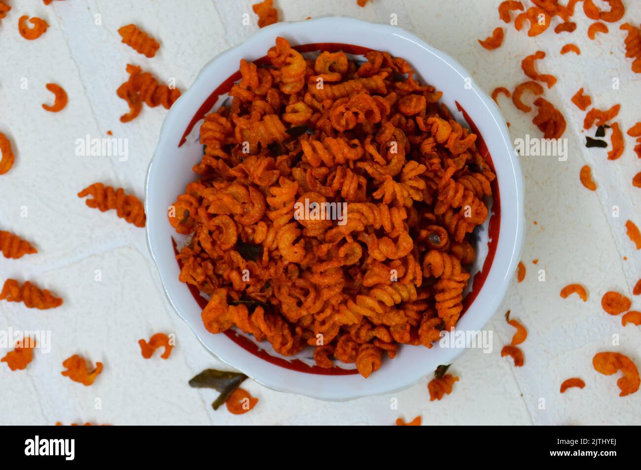 Savory and crunchy spicy macaroni in a bowl on a white background ...