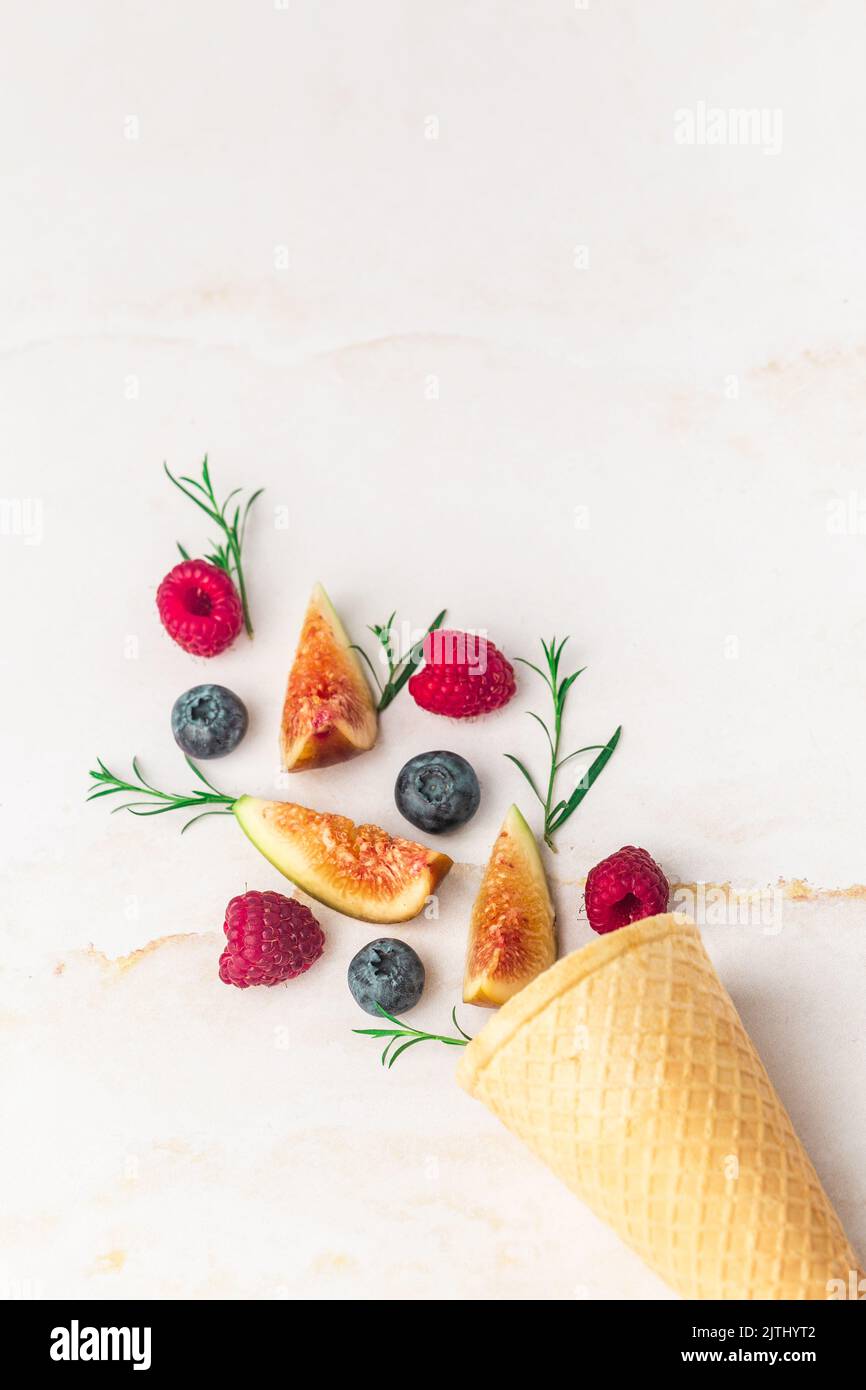 Ice cream cones with berries. Fresh berry fruit, top view of figs ...