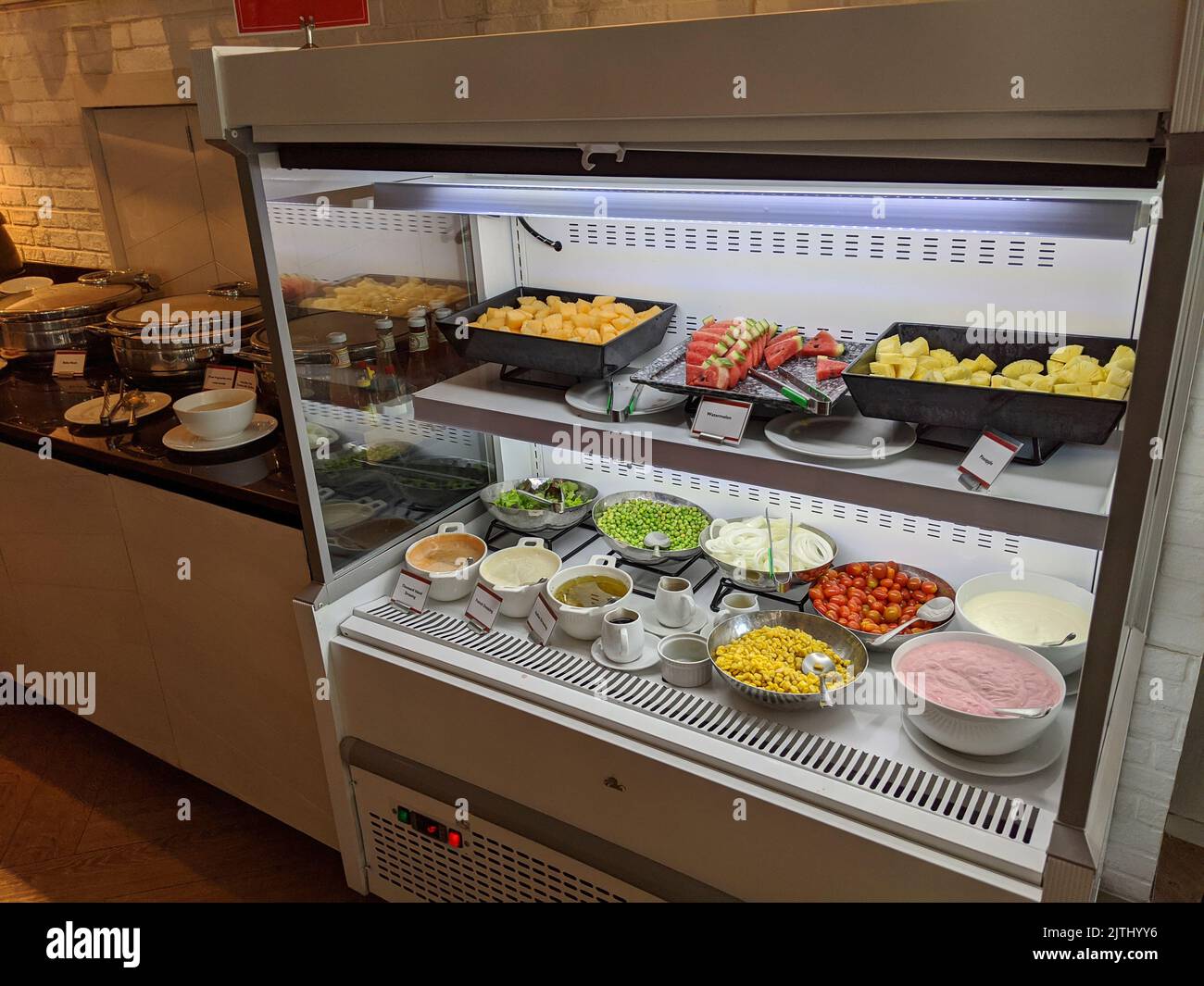 Food and drinks on offer in the buffet section of the business lounge ...