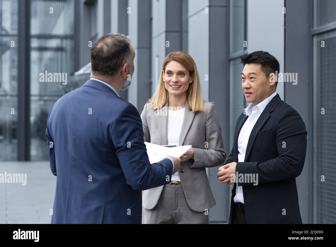 International business team meeting mature man, Caucasian woman, Asian ...