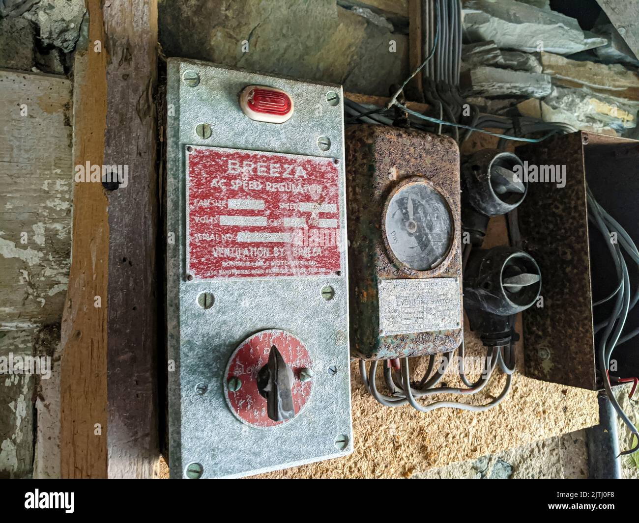 Very old speed controller, meter, switches and wiring in a farm barn ...