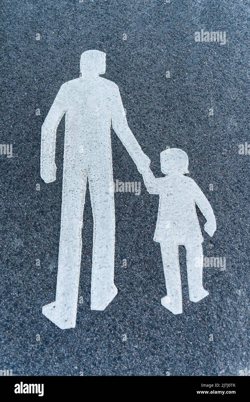 Image of Sign or symbol for pedestrians at the tiled road Stock Photo ...