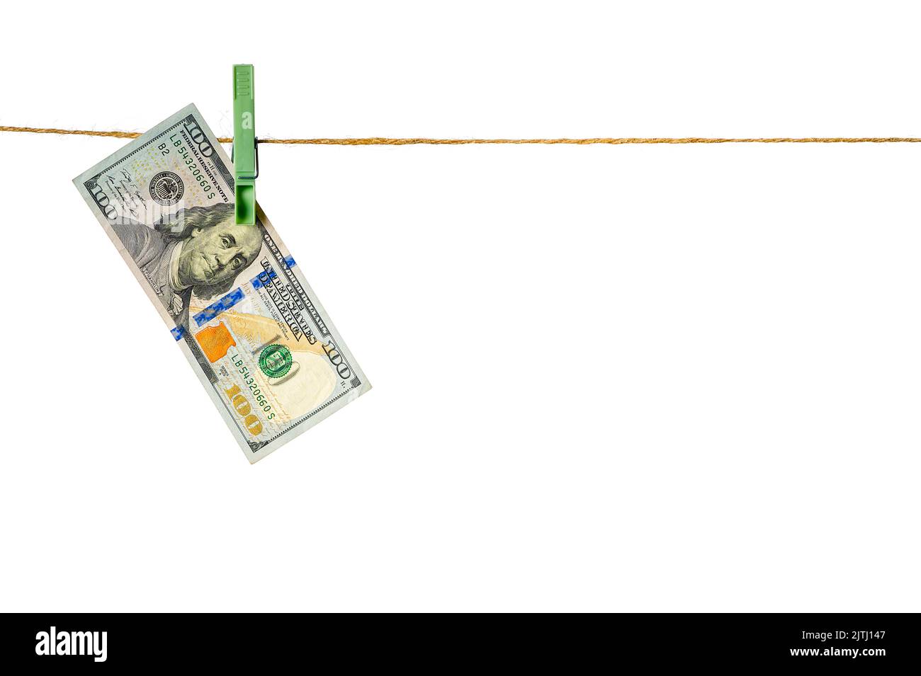 Money laundering. Dollar banknotes hanging on clothesline isolated on ...