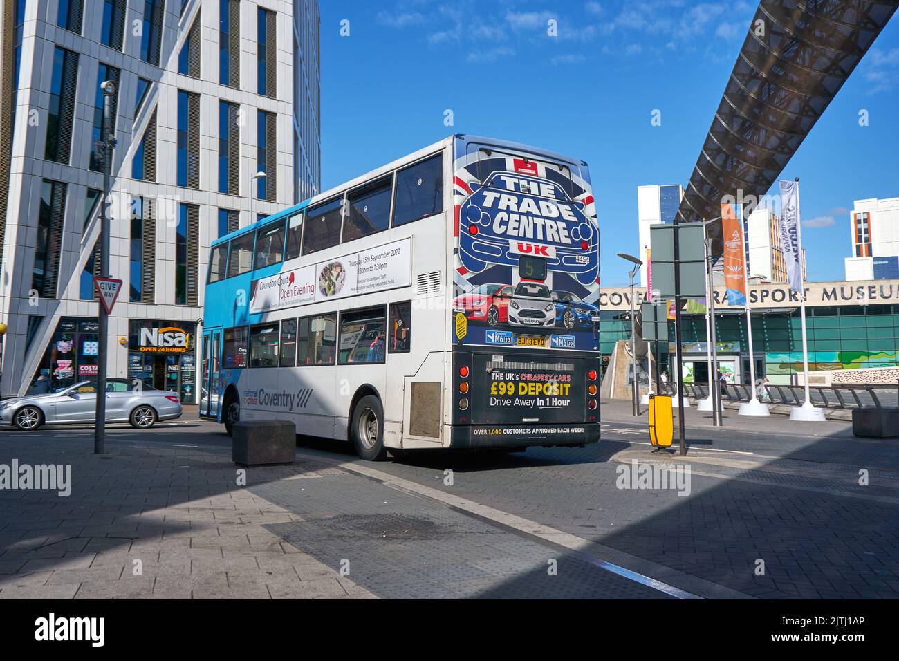 Modern bus on a street in Coventry, UK Stock Photo - Alamy