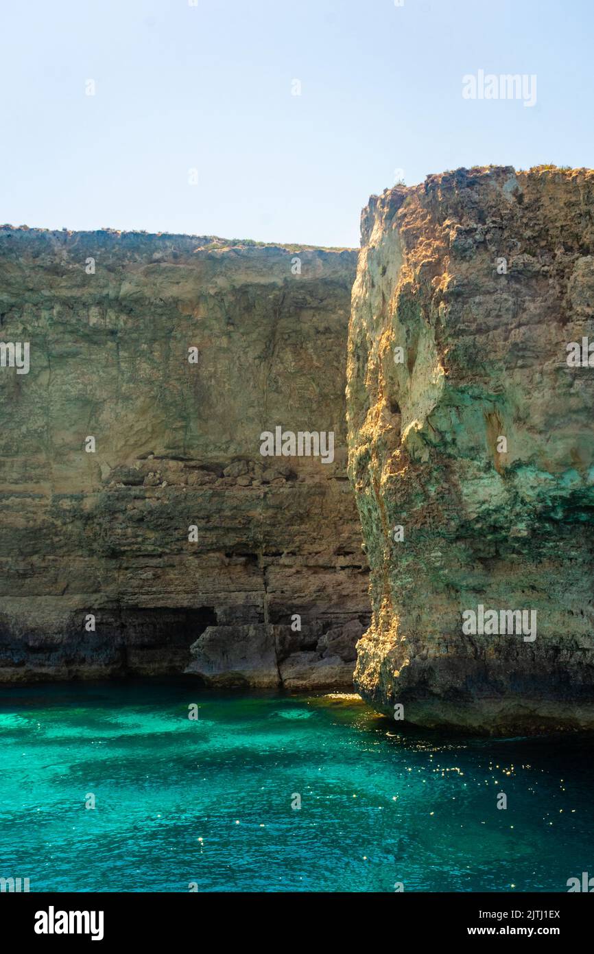Crystal clear water under the cliffs of Malta Stock Photo - Alamy